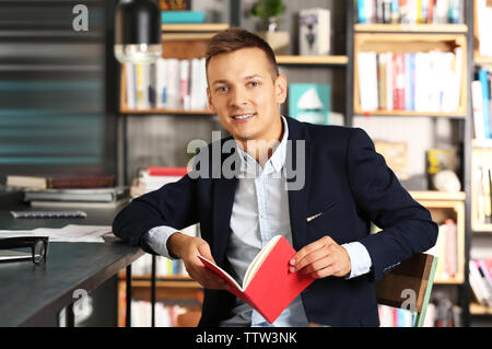Young businessman or student studying the science and symbols fl Stock ...