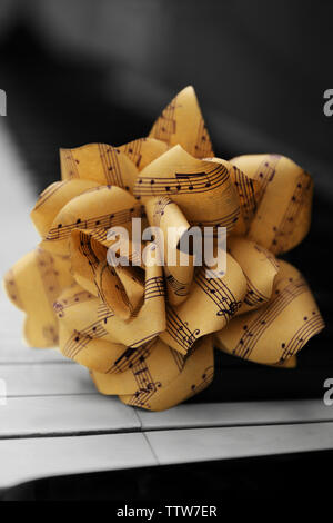 Rose made of music notes on piano keys Stock Photo - Alamy