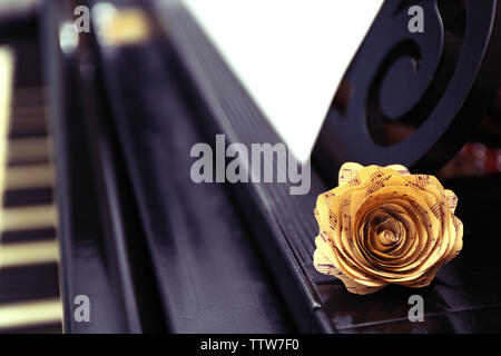 Rose made of music notes on black piano Stock Photo - Alamy