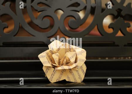 Rose made of music notes on piano keys Stock Photo - Alamy