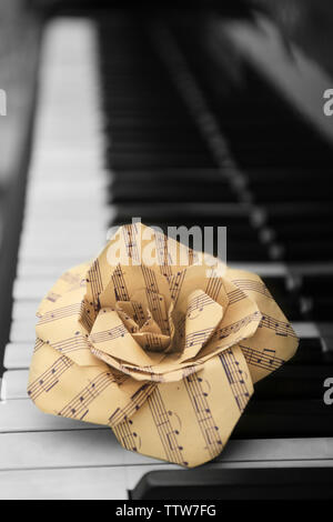 Rose made of music notes on piano keys Stock Photo - Alamy