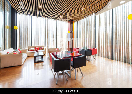 Modern gym lobby interior design with registration counter and sport ...