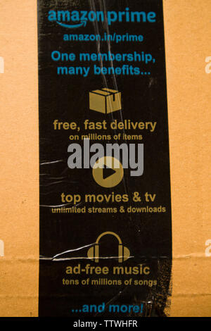 Amazon Prime logotype printed on cardboard box security scotch tape ...