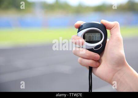 Female hand holding digital stopwatch, close up Stock Photo - Alamy