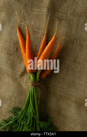 Fresh vegetables on burlap on bright background Stock Photo - Alamy