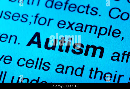 Newspaper article with detailed word AUTISM, closeup Stock Photo - Alamy