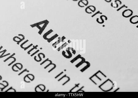 Newspaper article with detailed word AUTISM, closeup Stock Photo - Alamy