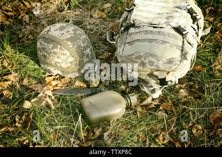 Military set on grass background Stock Photo - Alamy