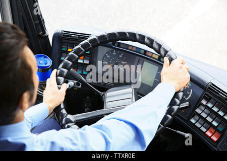 Handsome driver sitting in bus Stock Photo - Alamy