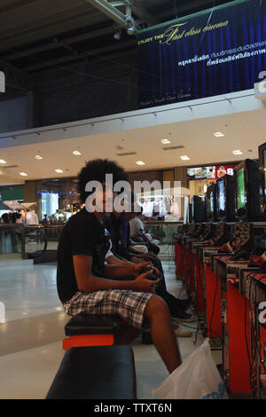 People playing arcade game, Phuket, Thailand Stock Photo - Alamy