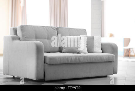 New cozy couch in modern room interior Stock Photo - Alamy