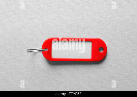 Red key tag on light background Stock Photo - Alamy