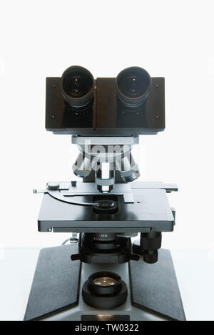 Microscope close-up. Examination of a micro sample on a glass slide ...