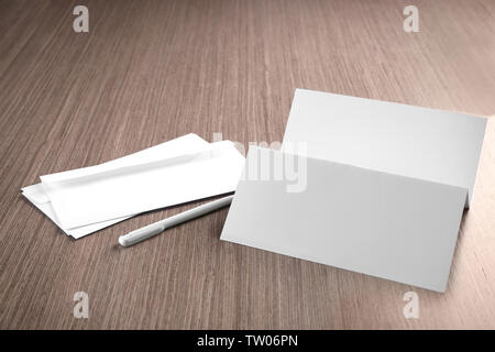 Blank goods on wooden table and grey background Stock Photo - Alamy