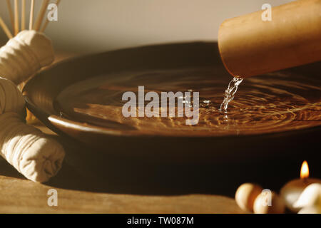 Beautiful spa composition with pouring water Stock Photo - Alamy