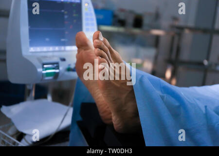 Feet of patient in operating room Stock Photo - Alamy