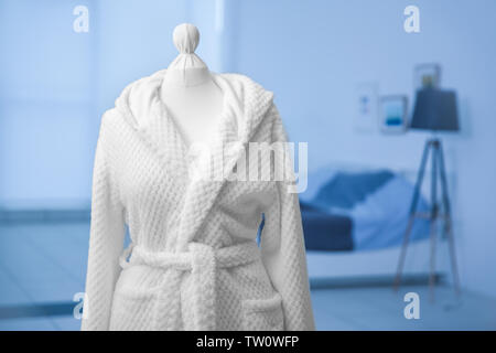 Bathrobe on dummy in room Stock Photo - Alamy