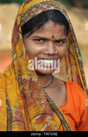 Close-up portrait of a smiling Bihar woman against white background ...