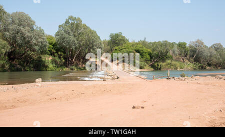 Daly River scene with native bushland, sandy shore and blue skies in ...