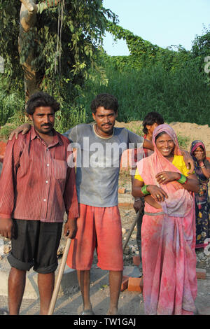 Group of villagers standing together and smiling Stock Photo - Alamy