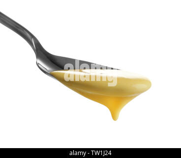 Creamy cheese pouring from spoon, isolated on white Stock Photo - Alamy