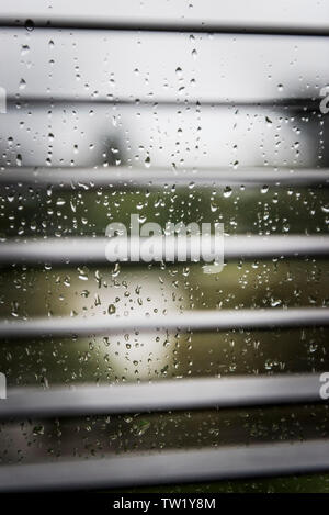 Raindrops on a glass window pane during wet weather England UK Stock ...