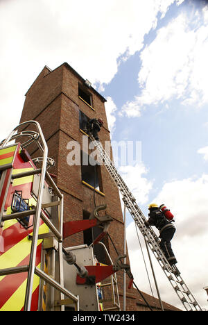 fire fighter climbing 13.5m ladder Stock Photo - Alamy