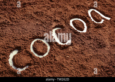Word COCOA drawn on brown powder background Stock Photo - Alamy
