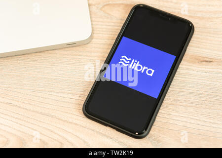 18 June 2019, Ljubljana Slovenia - Hand holding a smartphone with Libra ...