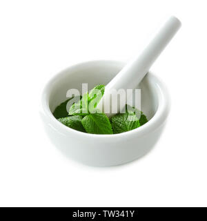 Mortar with leaves of lemon balm on white background Stock Photo - Alamy