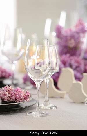 Beautiful table setting decorated with lilac blossom Stock Photo - Alamy
