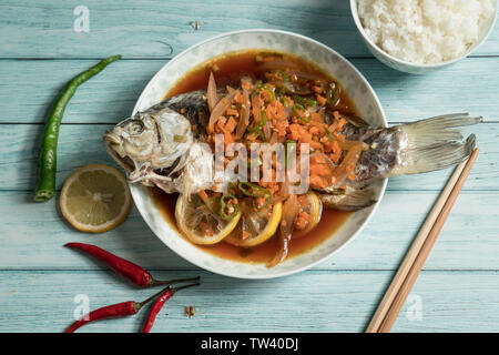Lemon fish with wood pattern background Stock Photo - Alamy