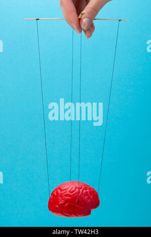 A puppeteer or puppet master manipulates his puppet on Market Street ...