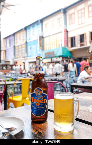 full glass bottle of beer on a black background Stock Photo - Alamy