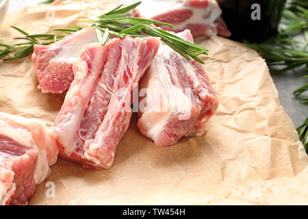 Raw ribs on parchment paper Stock Photo - Alamy