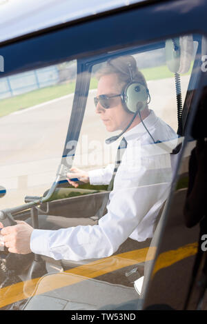 Headphones with a microphone in the helicopter cabin Stock Photo - Alamy