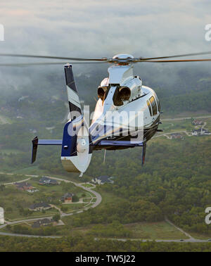 Corporate, Executive, military and law enforcement helicopter in flight ...
