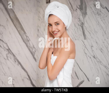 Beautiful young woman after shower on light background Stock Photo - Alamy