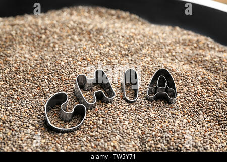 Letters on chia seeds, closeup Stock Photo - Alamy