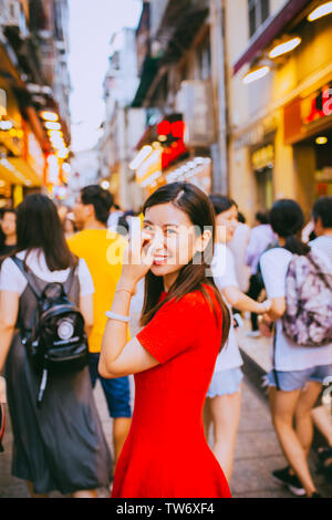 Red dress to Macau Stock Photo - Alamy