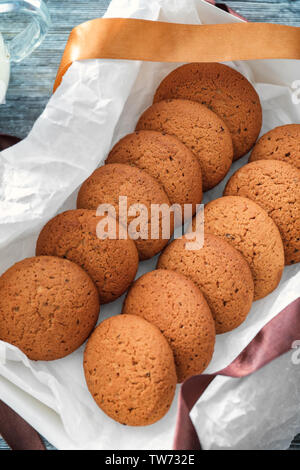 Box with delicious oatmeal cookies on wooden table Stock Photo - Alamy