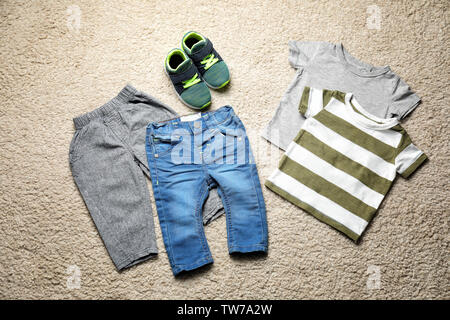 Composition with fashionable childish clothes on white background Stock ...