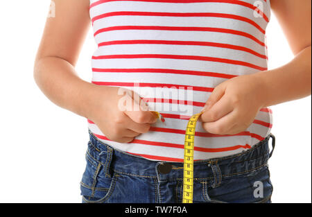 Overweight boy measuring his waist on white background Stock Photo - Alamy