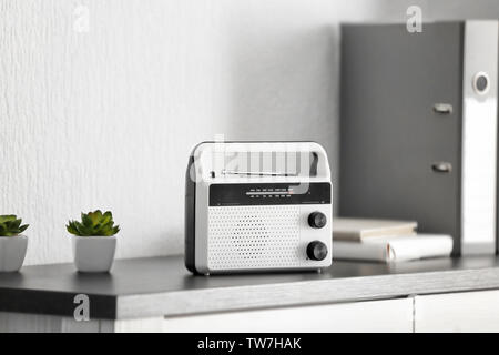 Modern workplace with retro radio receiver near brick wall Stock Photo ...