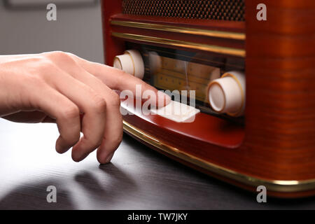Person tuning retro radio, closeup Stock Photo - Alamy