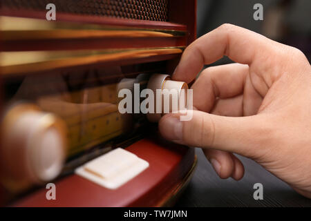 Person tuning retro radio, closeup Stock Photo - Alamy