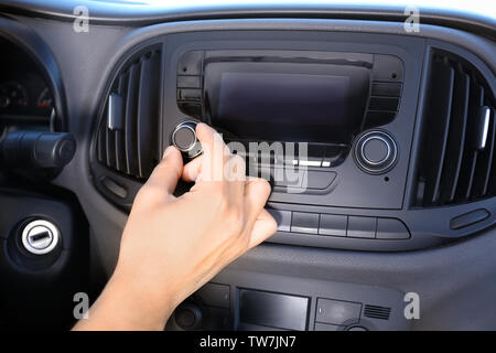 Man tuning car radio, closeup Stock Photo - Alamy