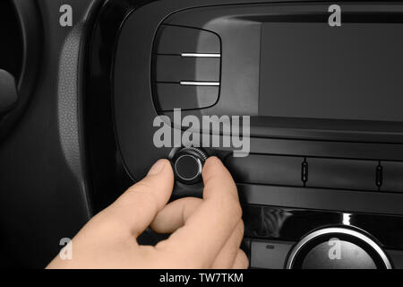 Man tuning radio in car Stock Photo - Alamy