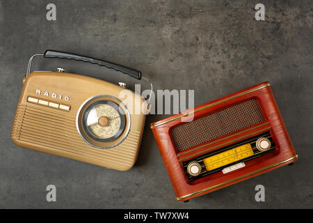 Retro radios on grey background Stock Photo - Alamy