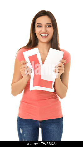 Young woman tearing learner driver sign on white background Stock Photo ...